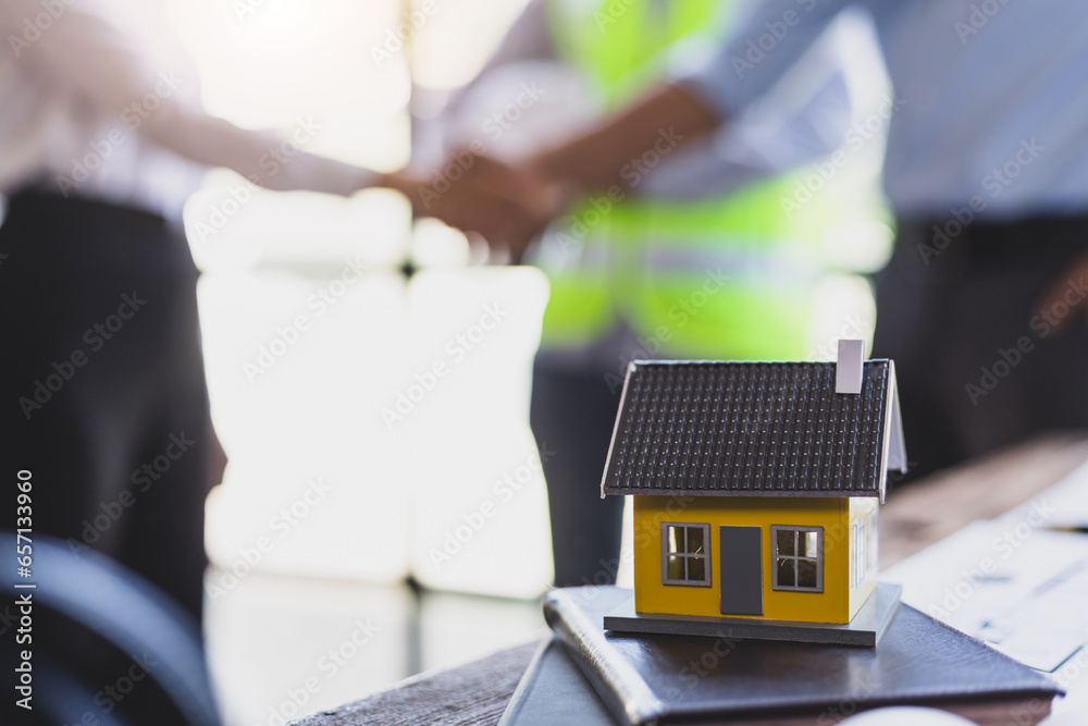 Collaboration of engineers, architects and contractors. Architects hand ...