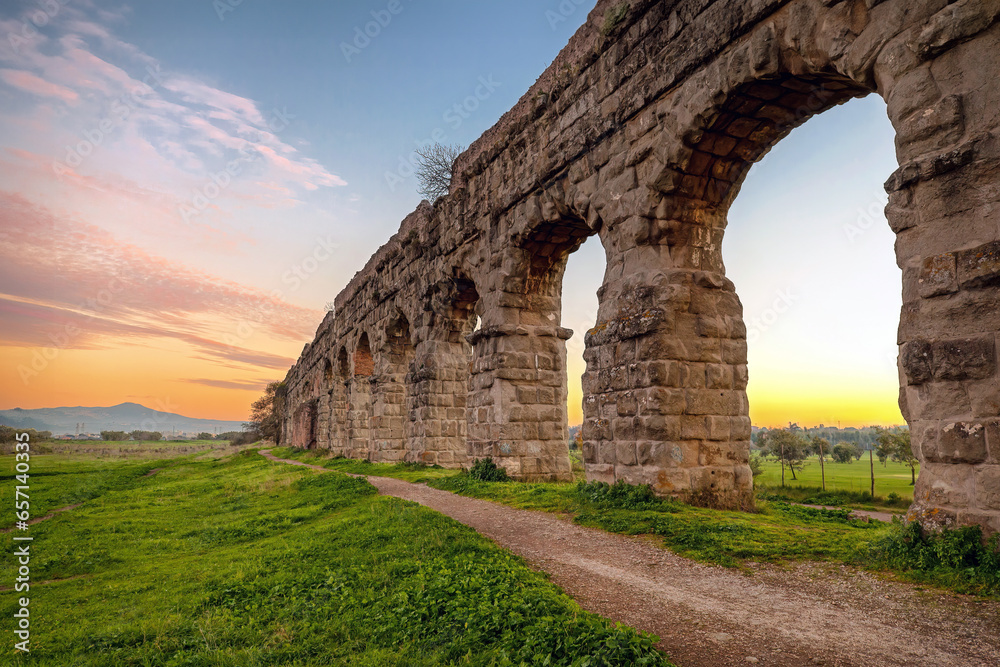 Roman aqueduct. Arches of an ancient Roman aqueduct, made of blocks of ...