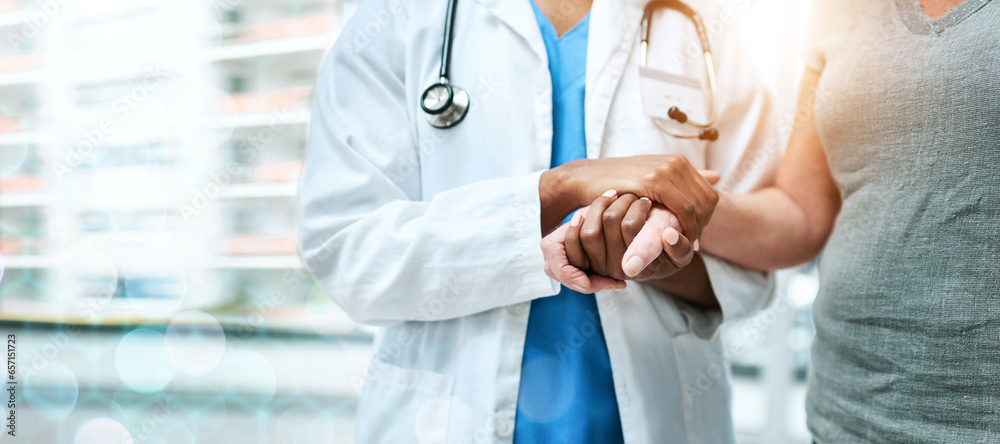 Closeup, doctor and patient with support, holding hands and teamwork ...