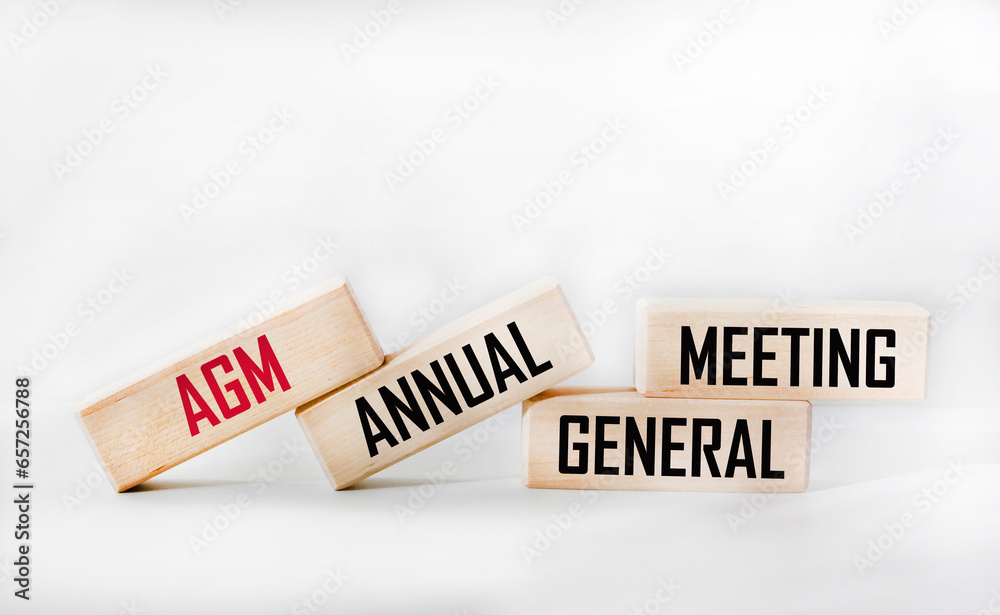 AGM is the symbol of the annual general meeting. Concept word AGM on ...