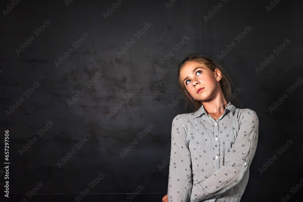 Portrait of pensive little kid girl 10 year old in casual attire posing ...