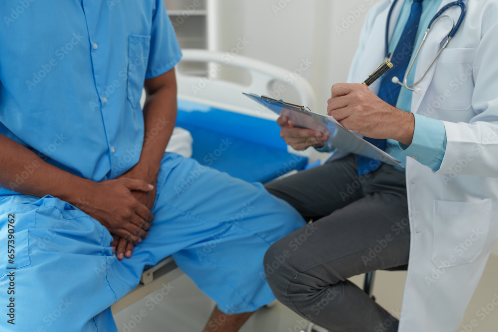 A male doctor is inquiring about the testicular cancer test report of a ...