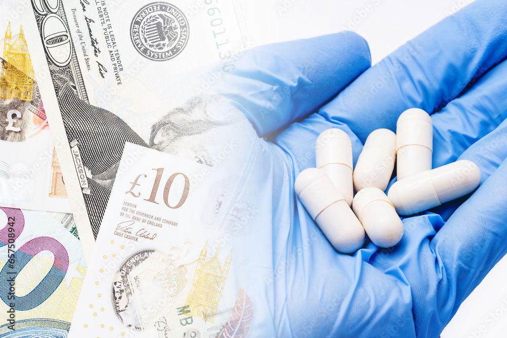 Big pharma background. Price of medicine. Cost of therapy.Hand in blue ...