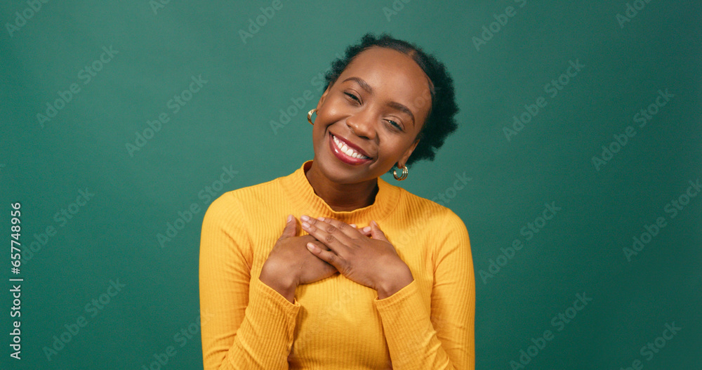 Beautiful woman puts hands on heart, infatuated and dreaming of crush ...