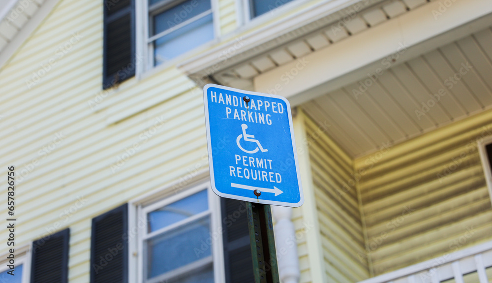 handicap wheelchair-accessible sign against a blurred background ...