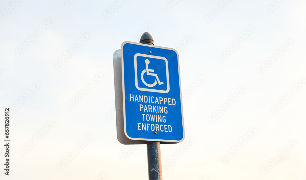 handicap wheelchair-accessible sign against a blurred background ...