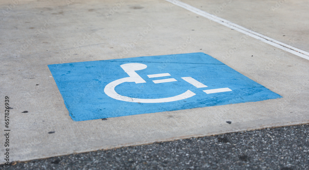 handicap wheelchair-accessible sign against a blurred background ...