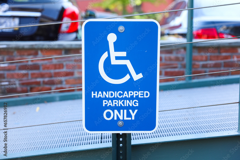 handicap wheelchair-accessible sign against a blurred background ...