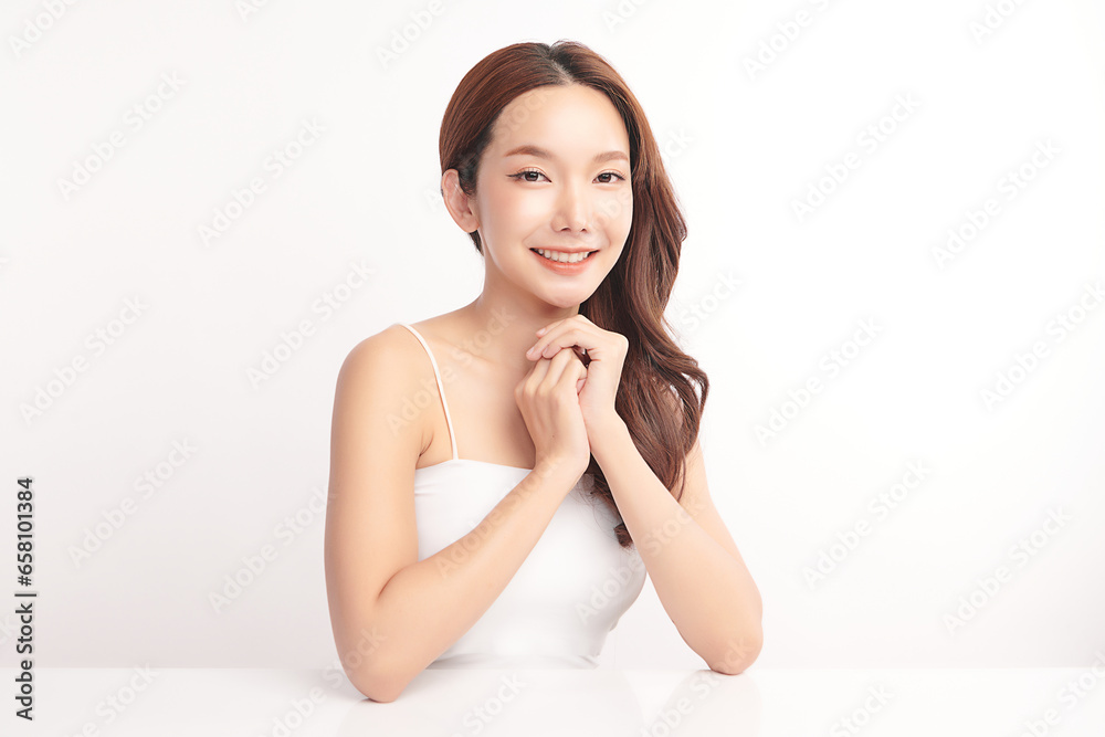 Beautiful young asian woman with clean fresh skin on white background ...