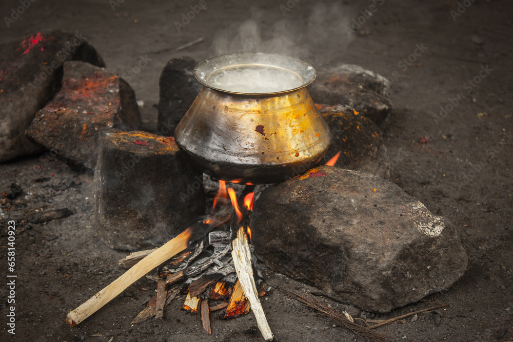 Traditional way of preparing food and offering to god during a temple ...