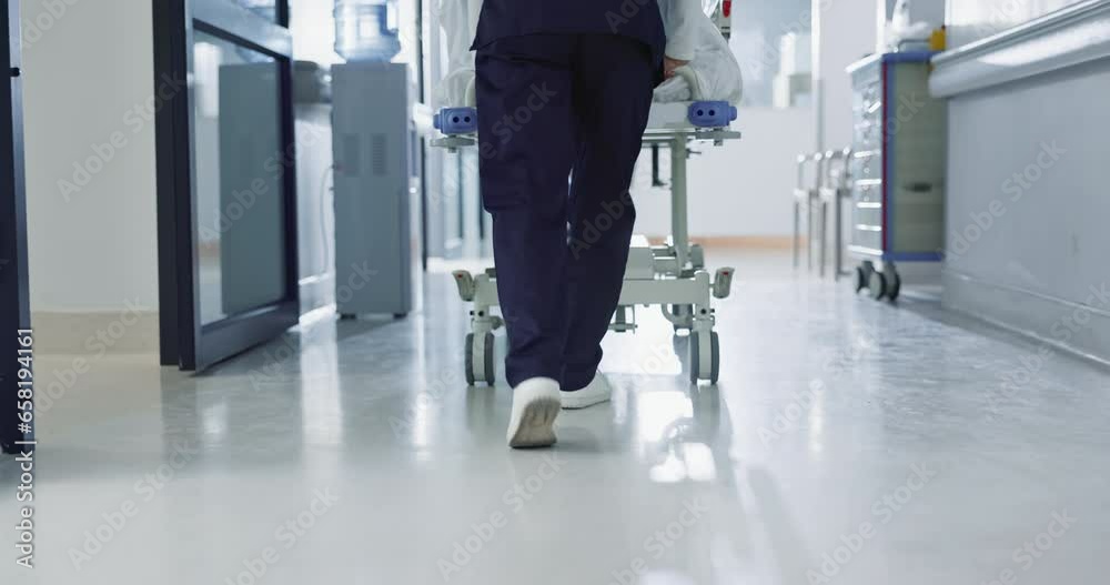 Patient, bed and nurse walking in hospital with feet or steps in ...
