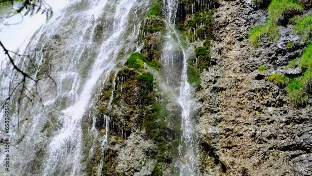 waterfall, powerful stream of river, flowing from Grain Alps, fast ...