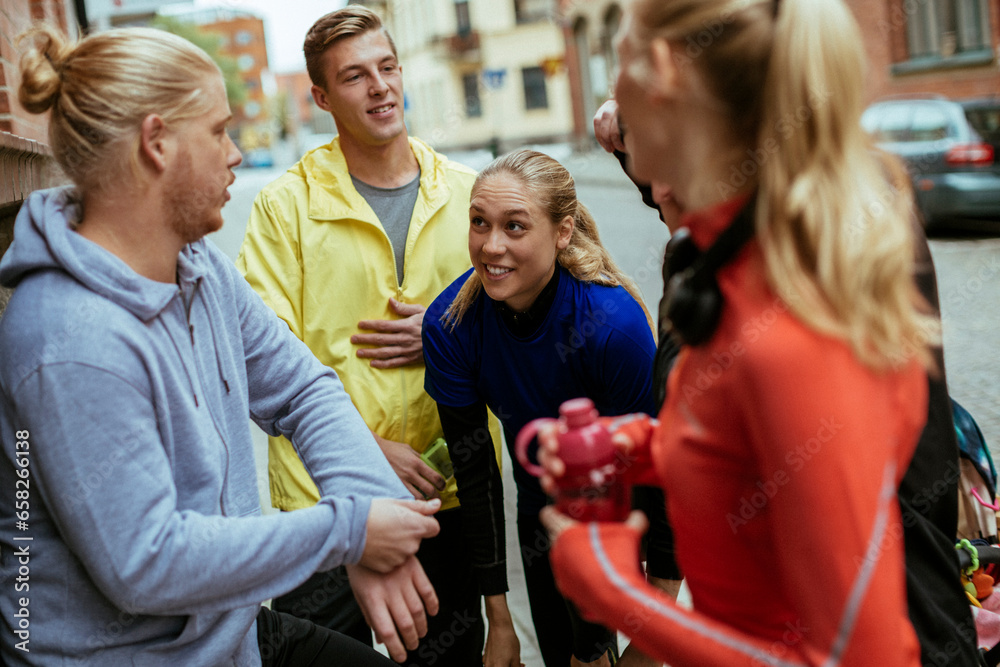 Young and diverse group of friends stretching and getting ready to ...