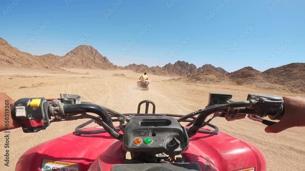 First person view of man hands holding the steering wheel of atv bike ...