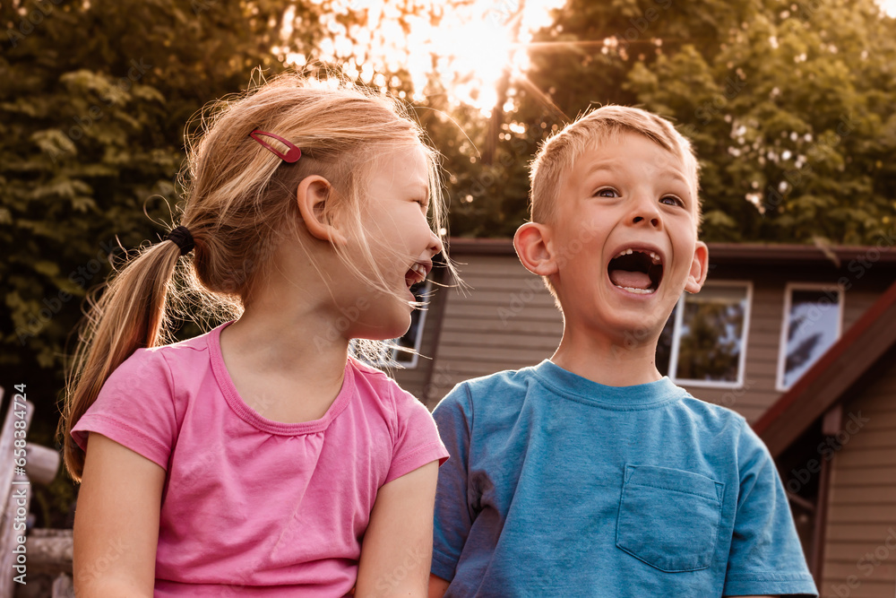 Two happy children brother sister smiling laughing together. Siblings ...