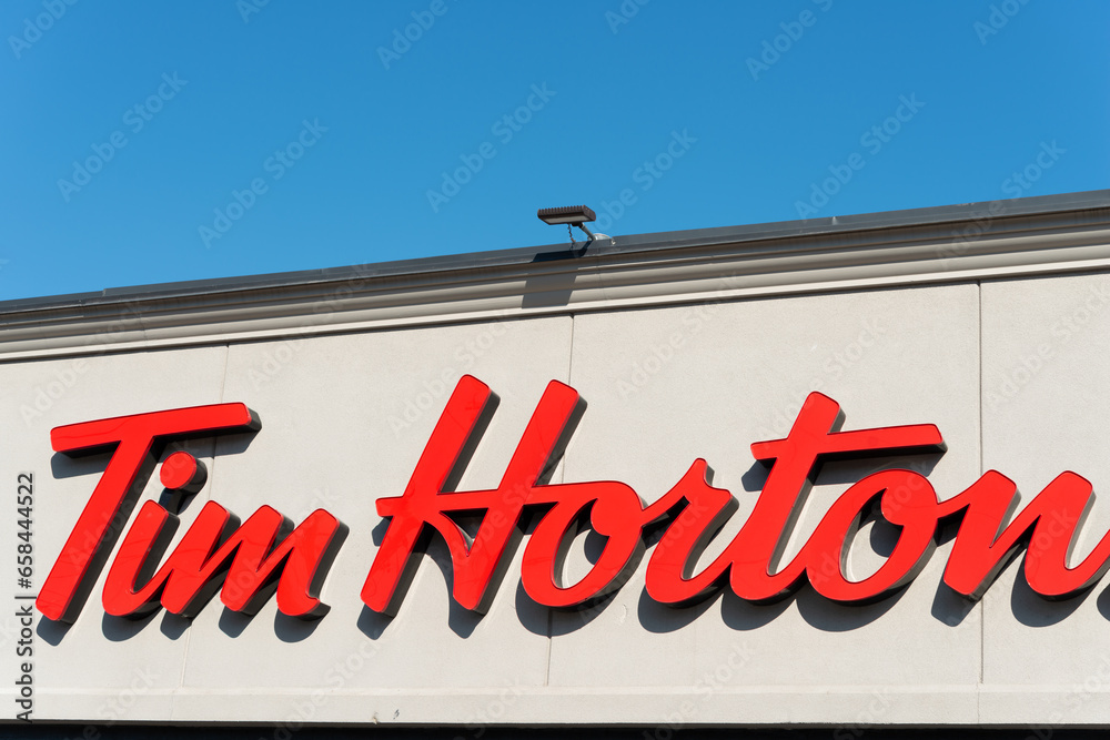 exterior sign of Tim Hortons on the side of a location in Toronto ...