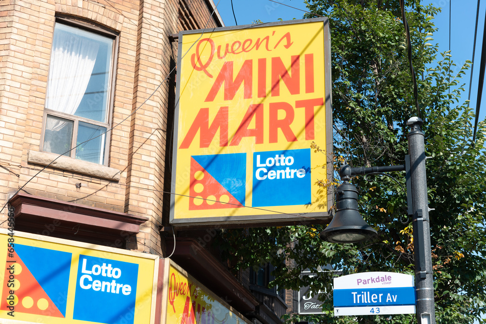exterior projecting sign outside Queens Mini Mart located at 1666 Queen ...