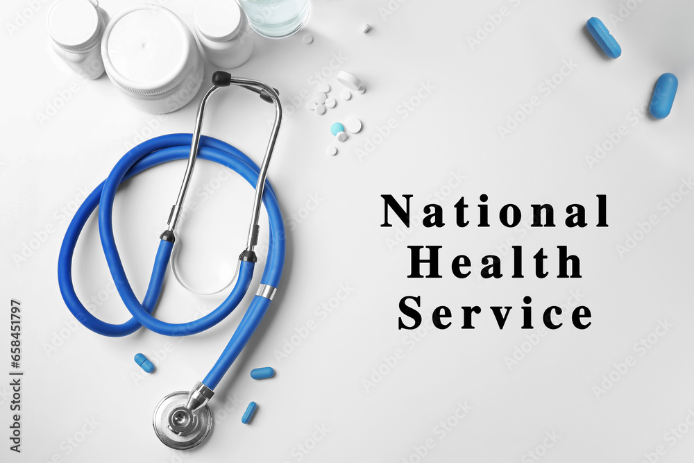 National health service (NHS). Stethoscope, pills and text on white ...