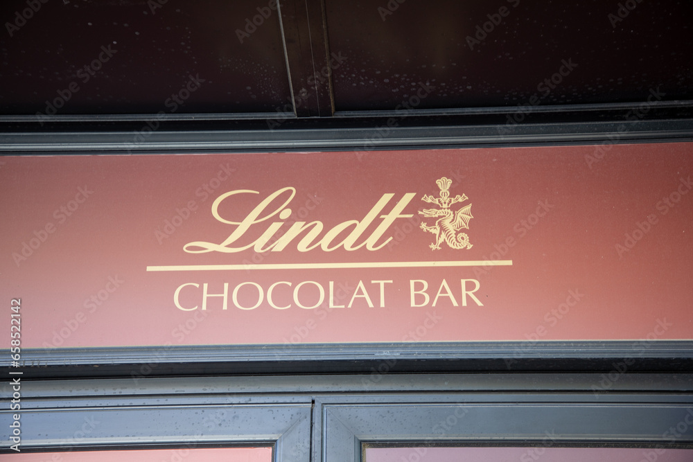 Lindt chocolat bar logo sign shop and brand text logo in wall interior ...