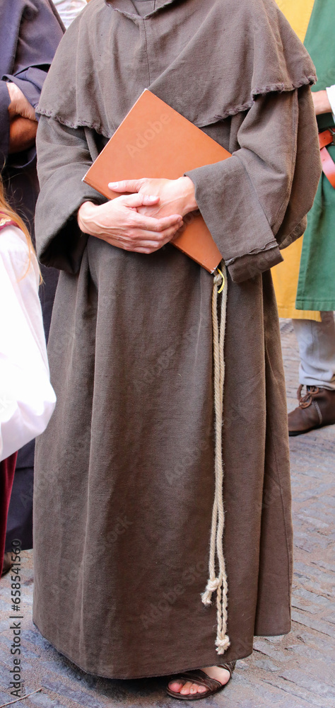Franciscan friar with the brown dress called habit and the rope around ...