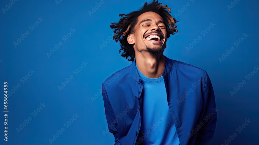Joyful Moment in Cobalt. A handsome model, beaming with a genuine laugh ...