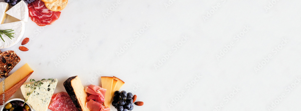 Selection of charcuterie cheeses, meats and appetizers. Above view ...