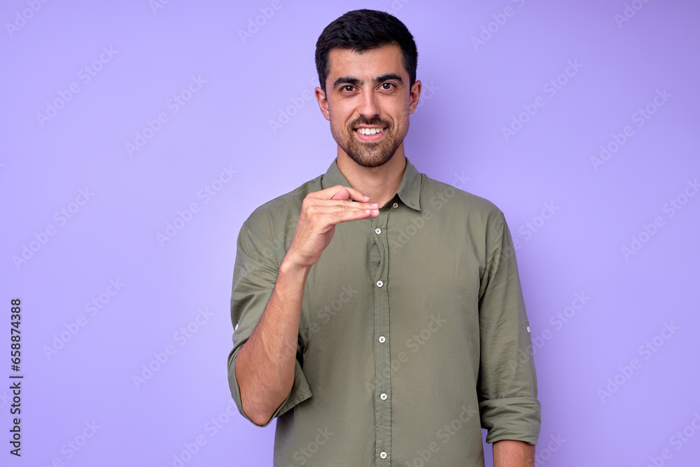 cheerful brunette bearded man demonstrating the letter M m . sign ...