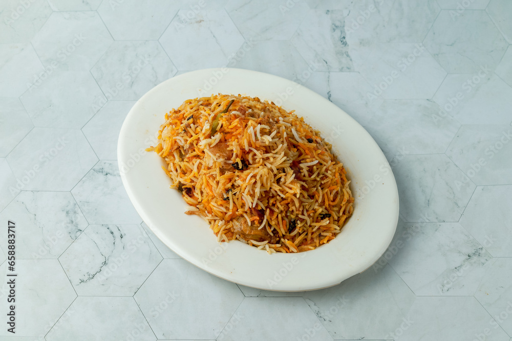 Chicken biryani served in a white dish ,basmati rice, traditional ...