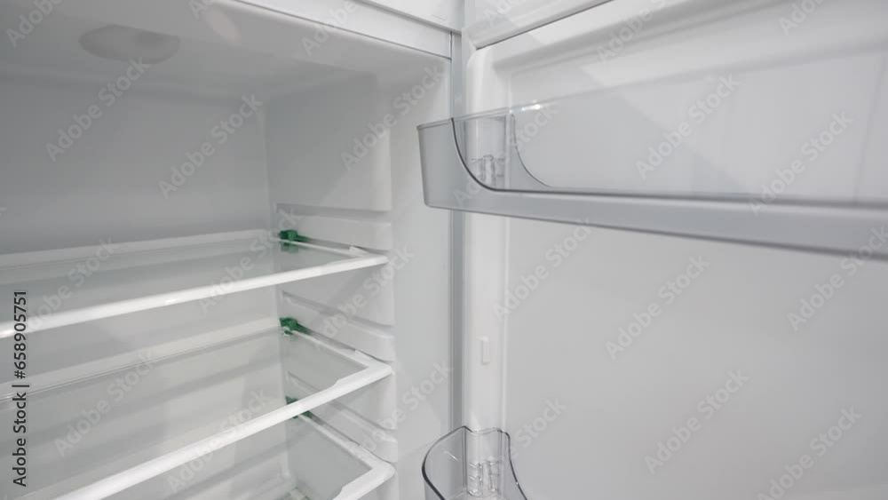 Open empty refrigerator. Refrigerator open empty fridge inside interior. Close up on empty ...
