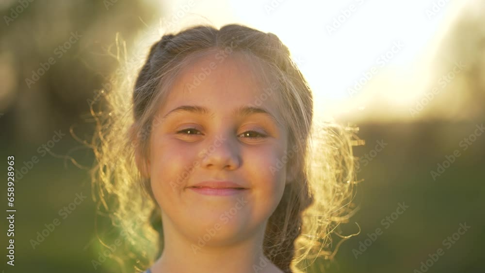 Happy girl in sun. Girl face in park hair in the wind. Dream girl ...