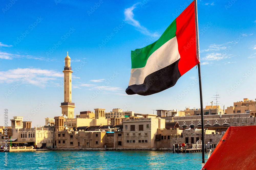 Photo & Art Print UAE flag against bay Creek, Dubai, Sergii Figurnyi
