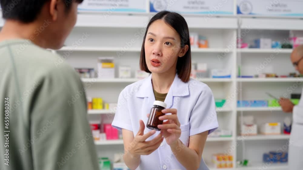 Beautiful asian female pharmacist analyzing about customer symptoms for ...