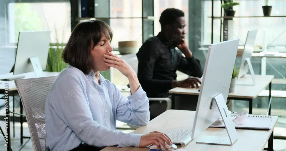 Exhausted businessmen wind down at the end of a long workday in the ...