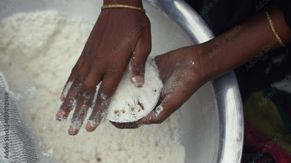Making traditional rice cake called Bhapa Pitha, a soft and syrupy rice ...