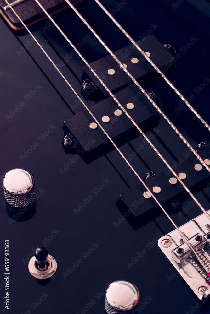 Electric bass and strings. Musical instrument background for poster ...