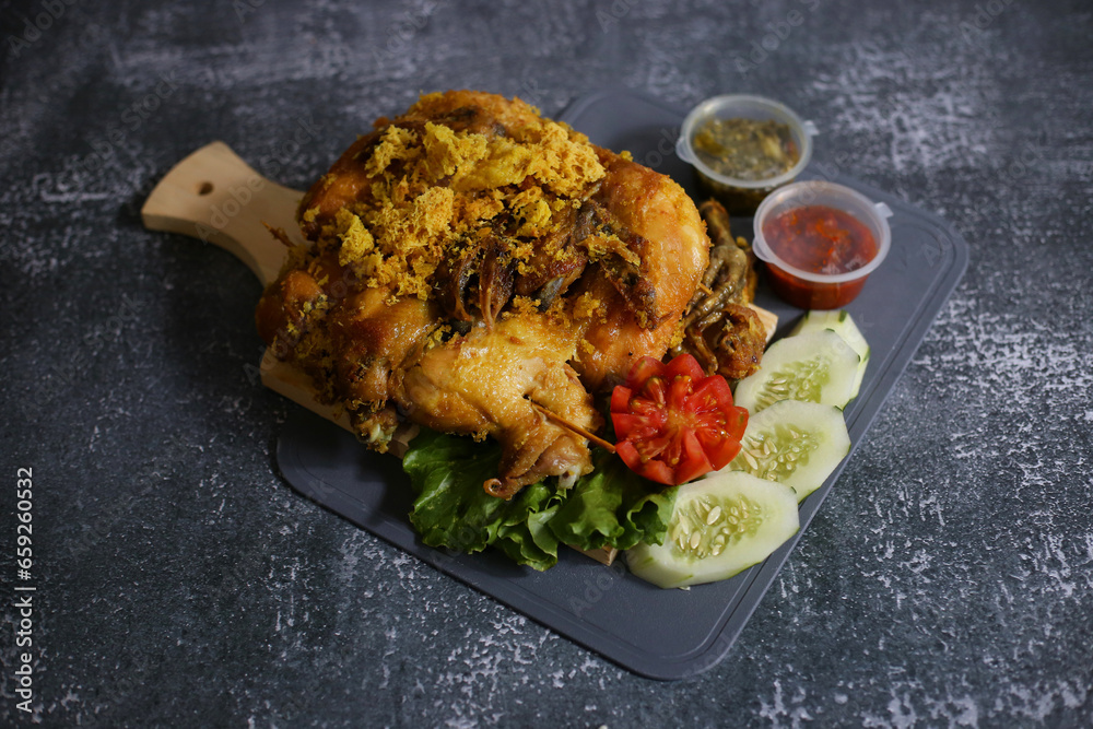 Ayam Goreng Kalasan Kremes. Popular fried chicken dish from Jogjakarta, deep-fried whole chicken ...