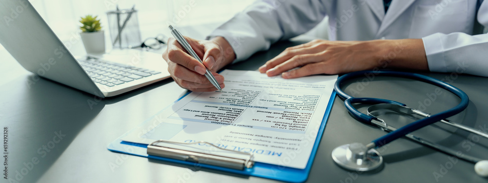 Doctor carefully review detailed medical report with laptop and ...