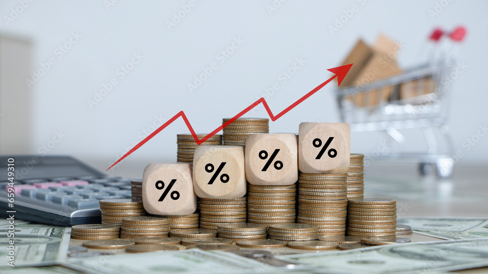 Inflation and tax concept. Wooden blocks with percentage sign on coins ...