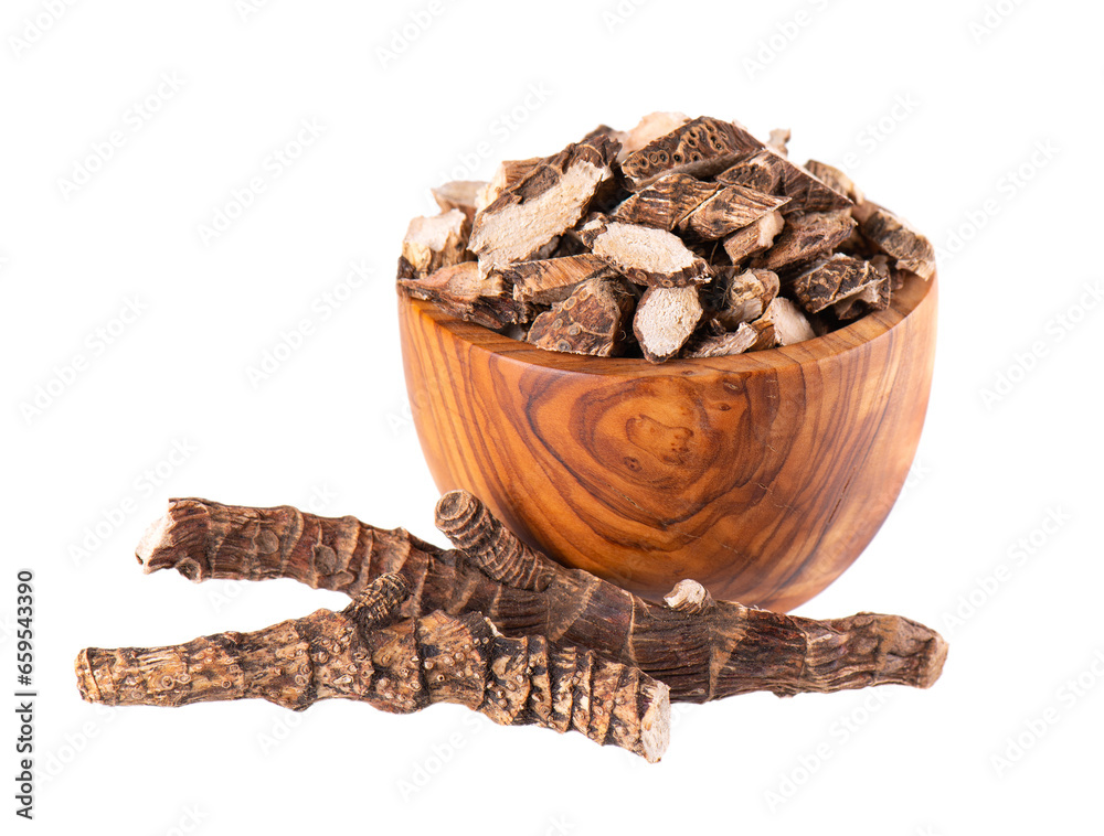 Calamus root in wooden bowl, isolated on white background. Sweet flag ...