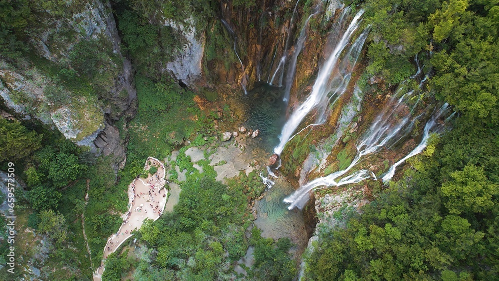 High waterfall and river streams flowing and falling down. Aerial top ...