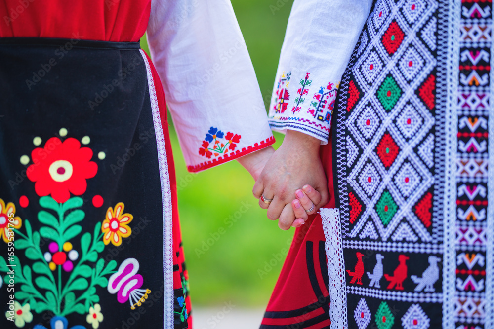 Girls in traditional bulgarian ethnic costumes with folklore embroidery ...