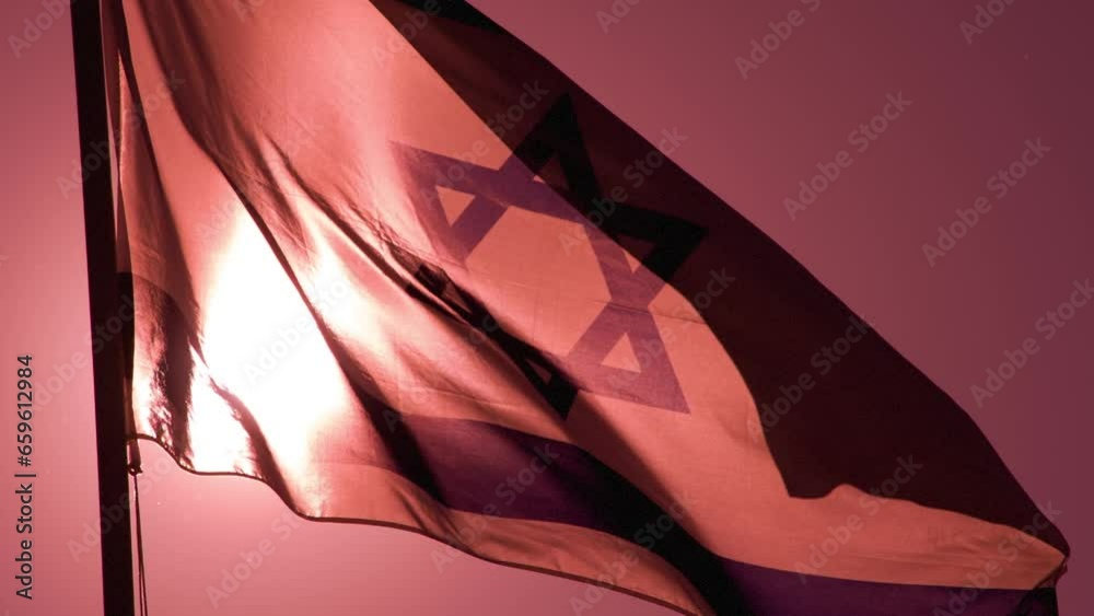 Israeli Flag in the Dawn Rays. The Big State Flag is illuminated by the ...