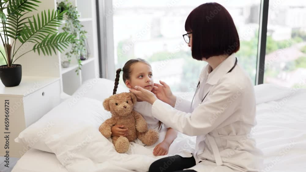 Vidéo Stock Smiling doctor gently touching neck while examining lymph ...