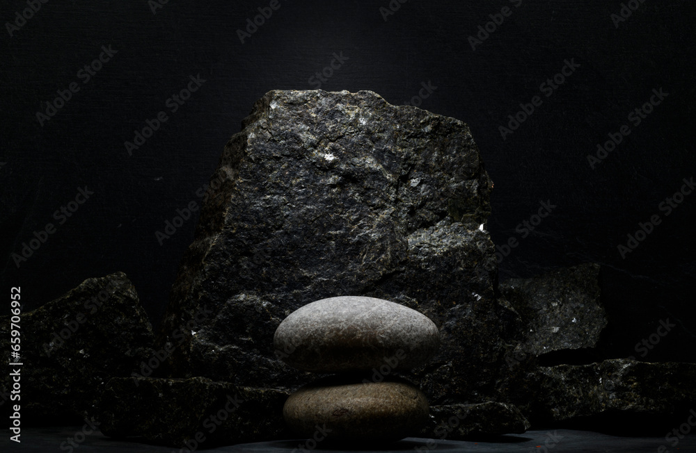 stones on a dark background for a product presentation. a composition ...
