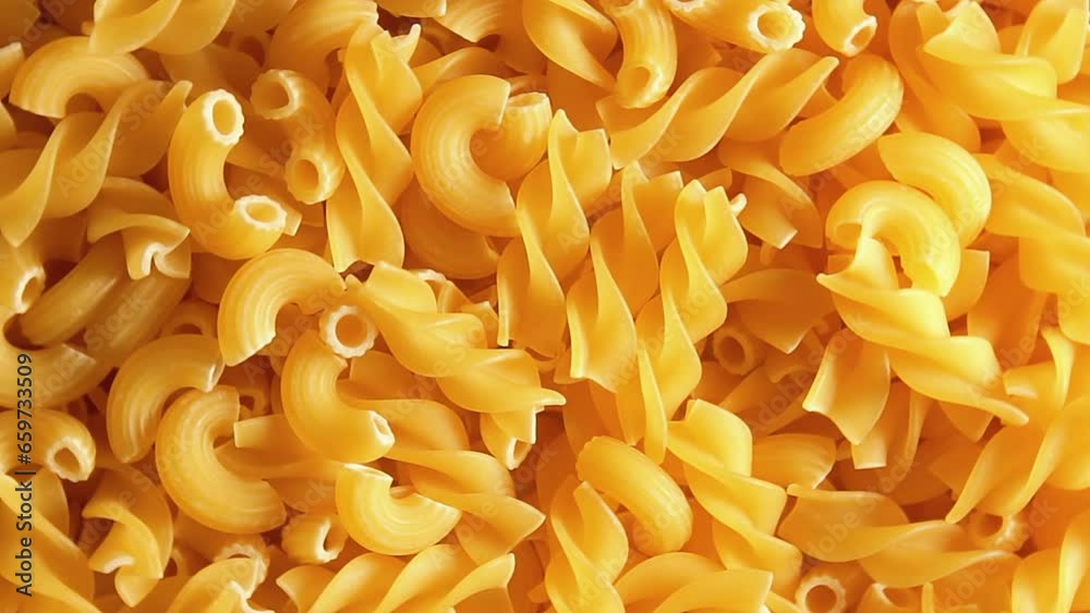 Uncooked Fusilli and Chifferi Rigati Pasta - Top View. Fat and ...