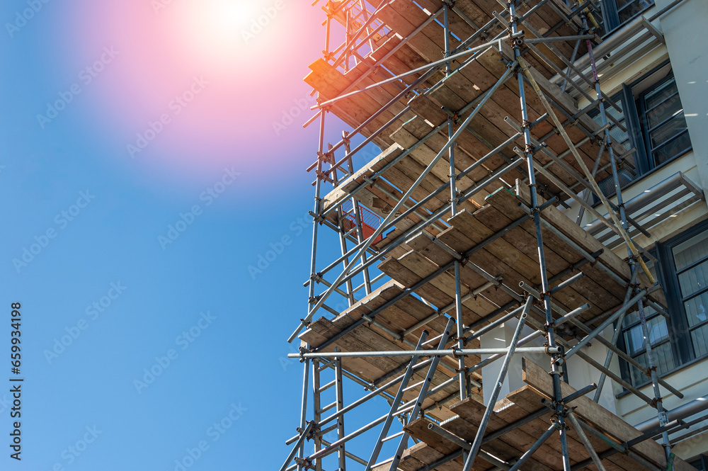 Scaffolding on multi storey building exterior during facade renovation ...