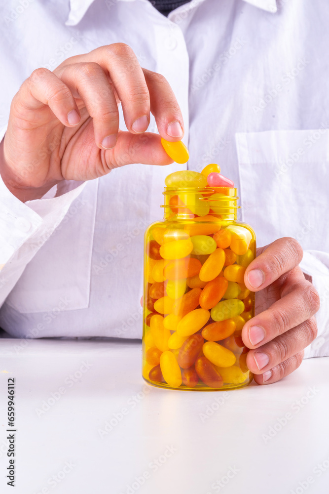 Gummy Vitamins and supplement for adults. Woman eats sweet jelly ...