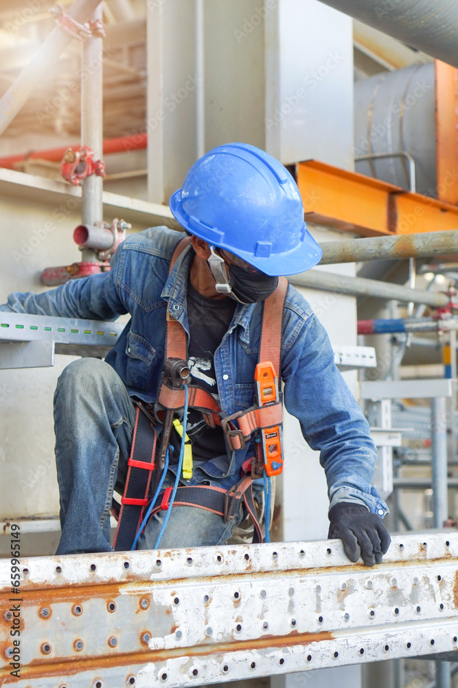 Scaffolding workers and scaffolding equipment in industrial plants ...