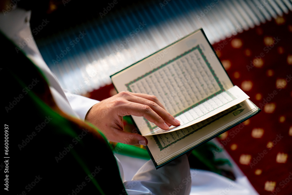 Islamic prayer concept Close-up of a Muslim man praying with the Holy ...