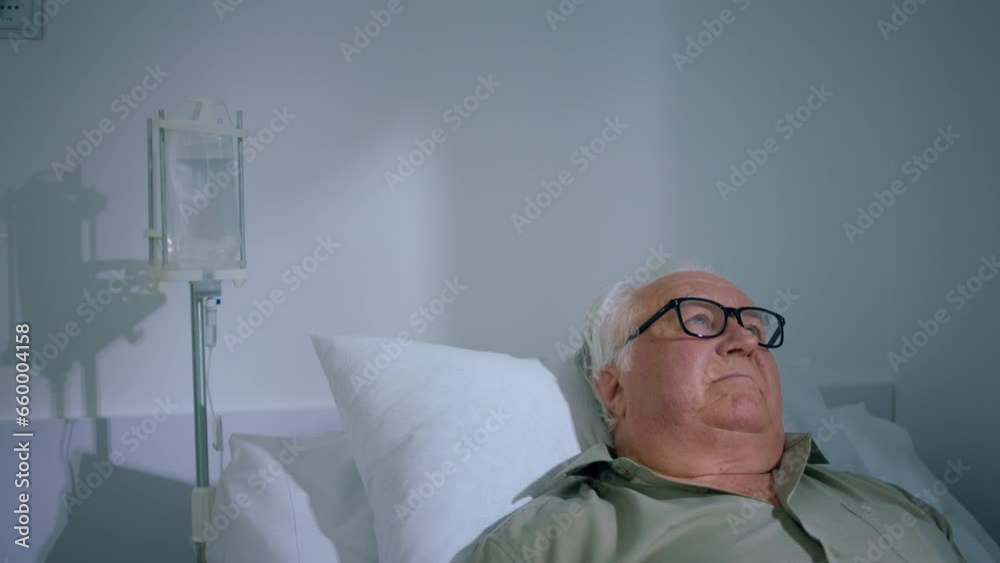 Old man patient laying down on the hospital couch he have a checkup he ...